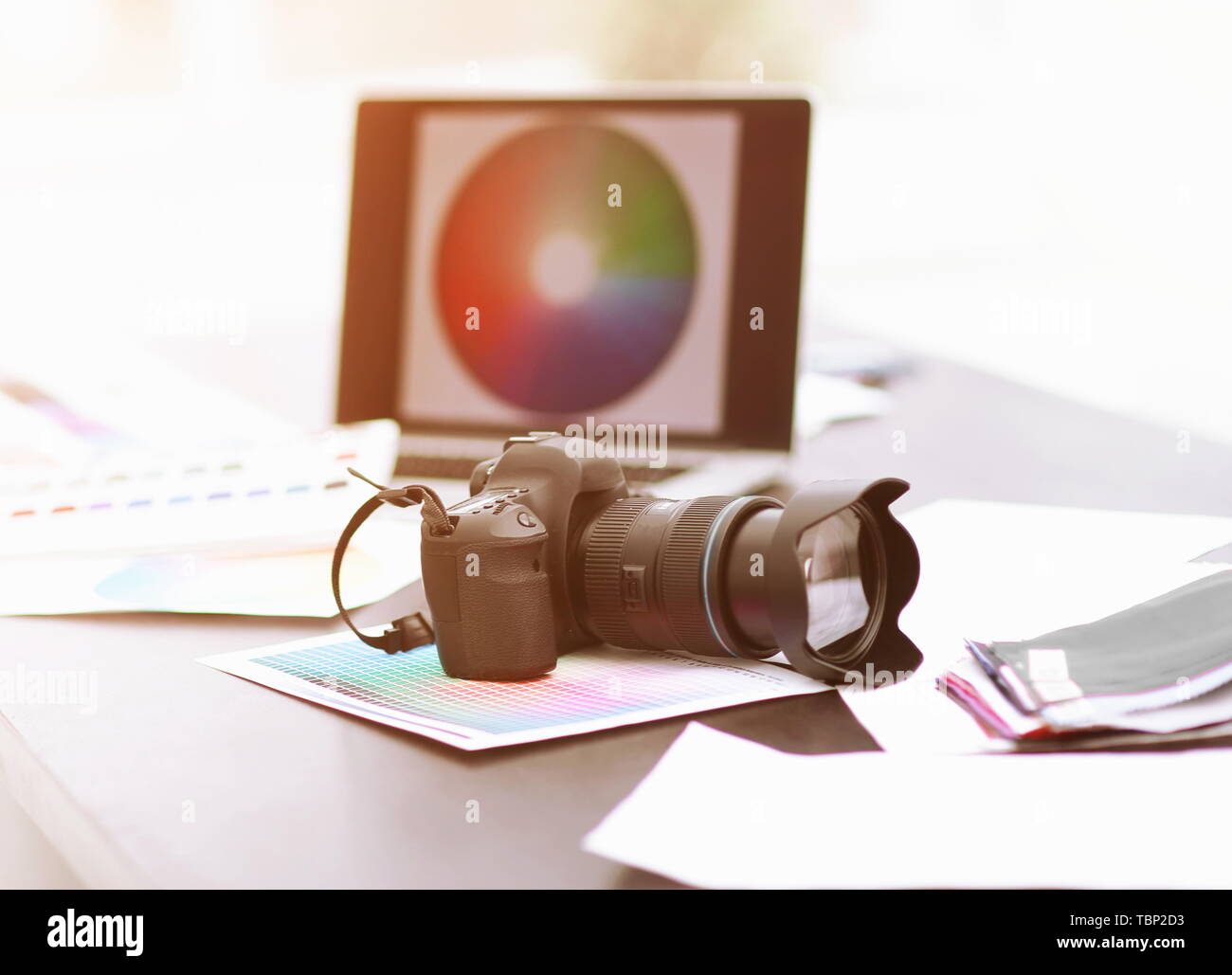 camera,fabric samples and sketches are on the desktop.camera,fabric ...