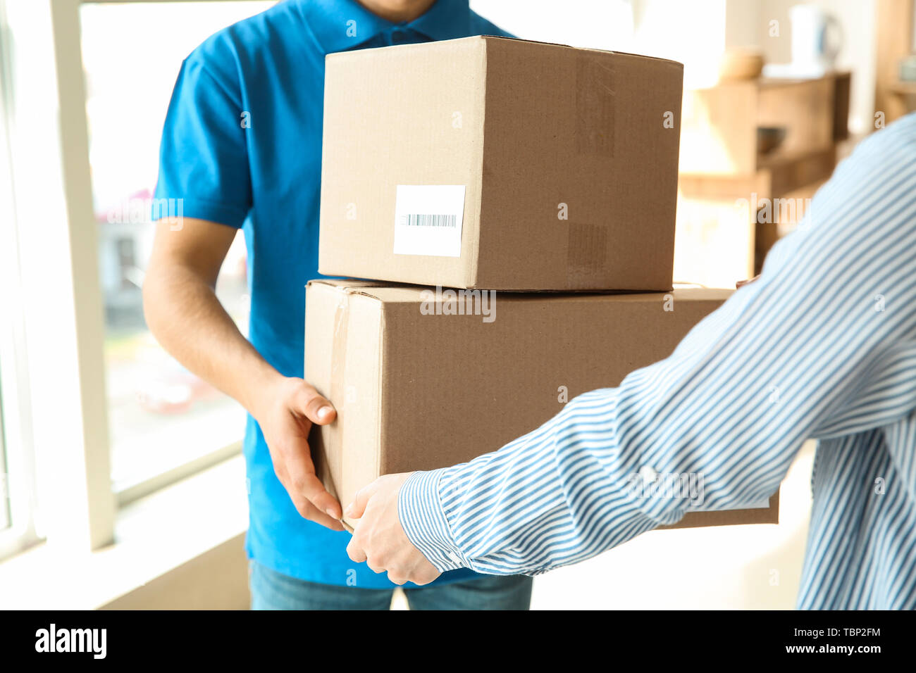 Female customer receiving boxes hi-res stock photography and images - Alamy