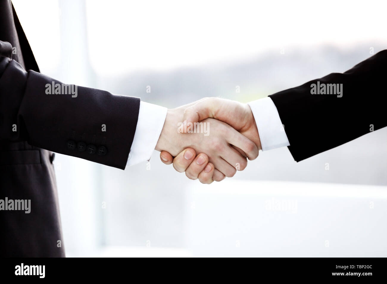 close up.handshake of business partners on blurred background.the ...