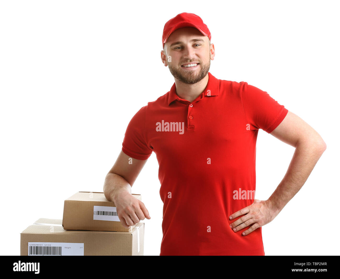 Handsome delivery man with boxes on white background Stock Photo - Alamy