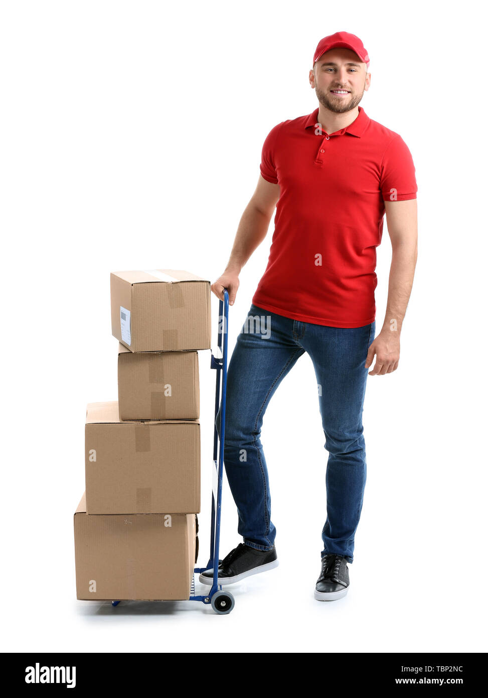 Handsome delivery man with boxes on white background Stock Photo - Alamy