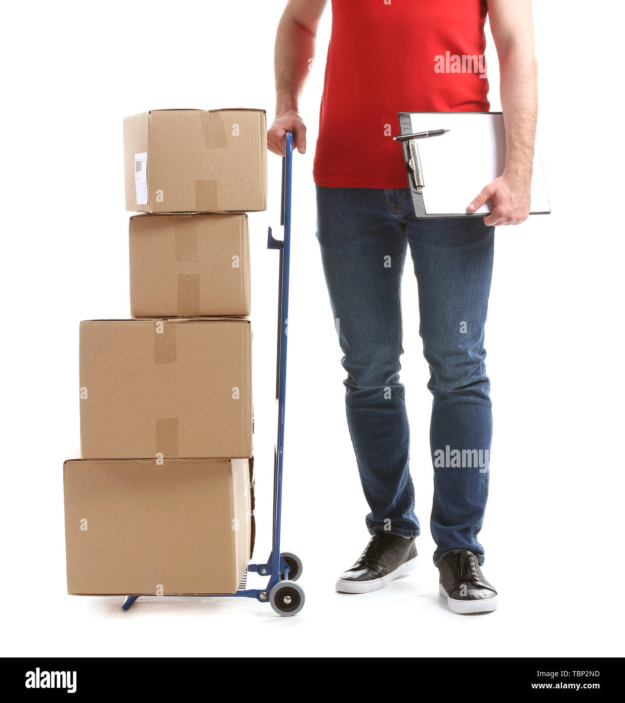 Handsome delivery man with boxes on white background Stock Photo - Alamy