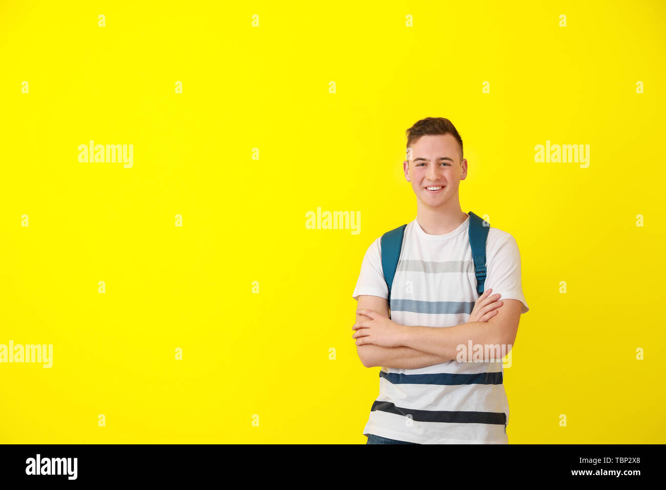 Cute teenage boy on color background Stock Photo - Alamy