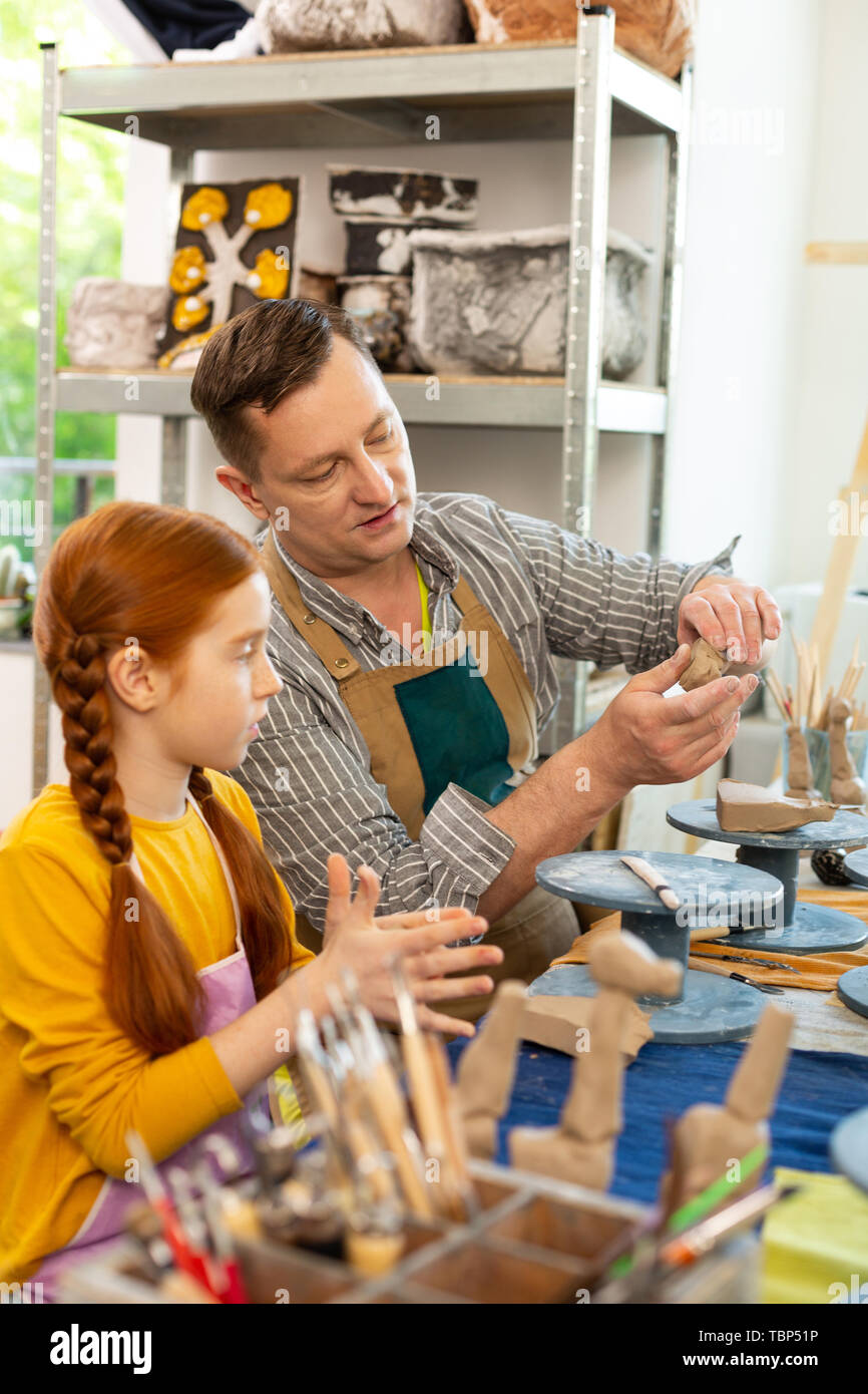 Girl feeling interested. Red-haired beautiful girl feeling interested ...