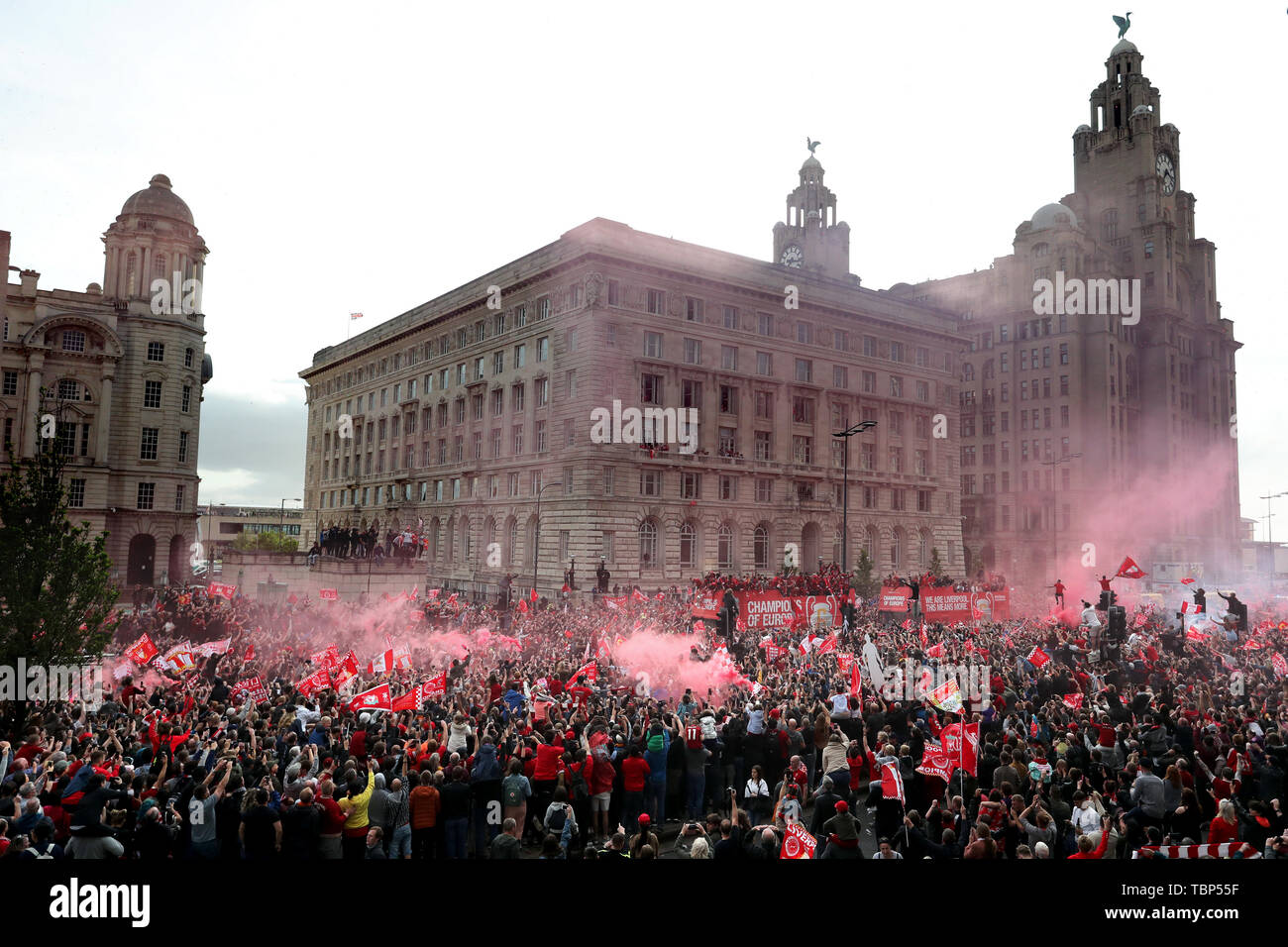 The buses pass the Liver Building during the Champions League Winners ...