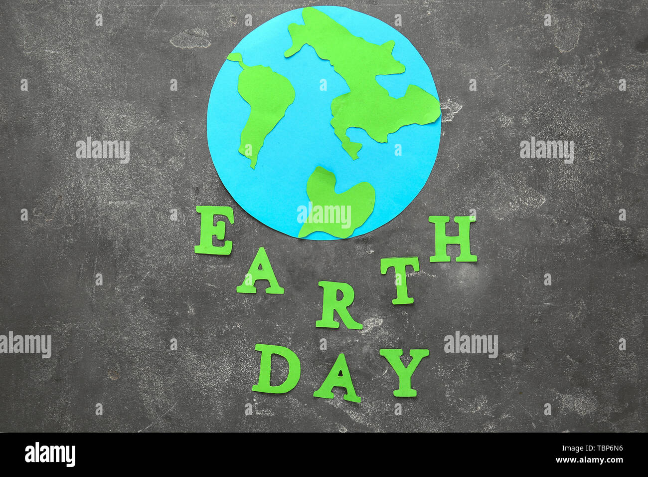 Text EARTH DAY composed from letters and shape of planet on grunge ...