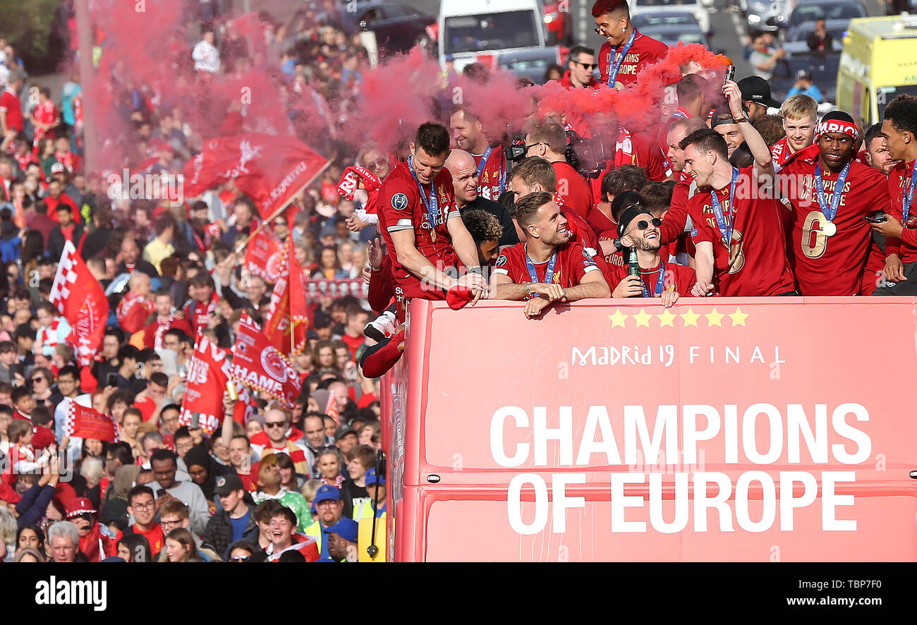 Liverpool's Jordan Henderson (centre left) on an open top bus during ...