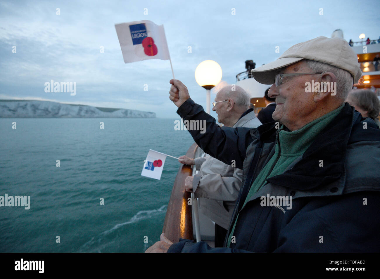 Veterans wave flags from the MV Boudicca as it leaves the port of Dover ...