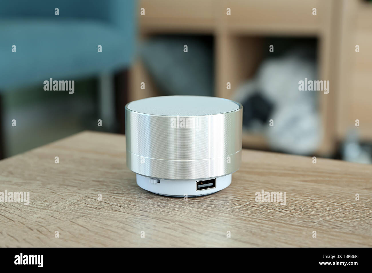 Smart home assistant device on table in room Stock Photo - Alamy