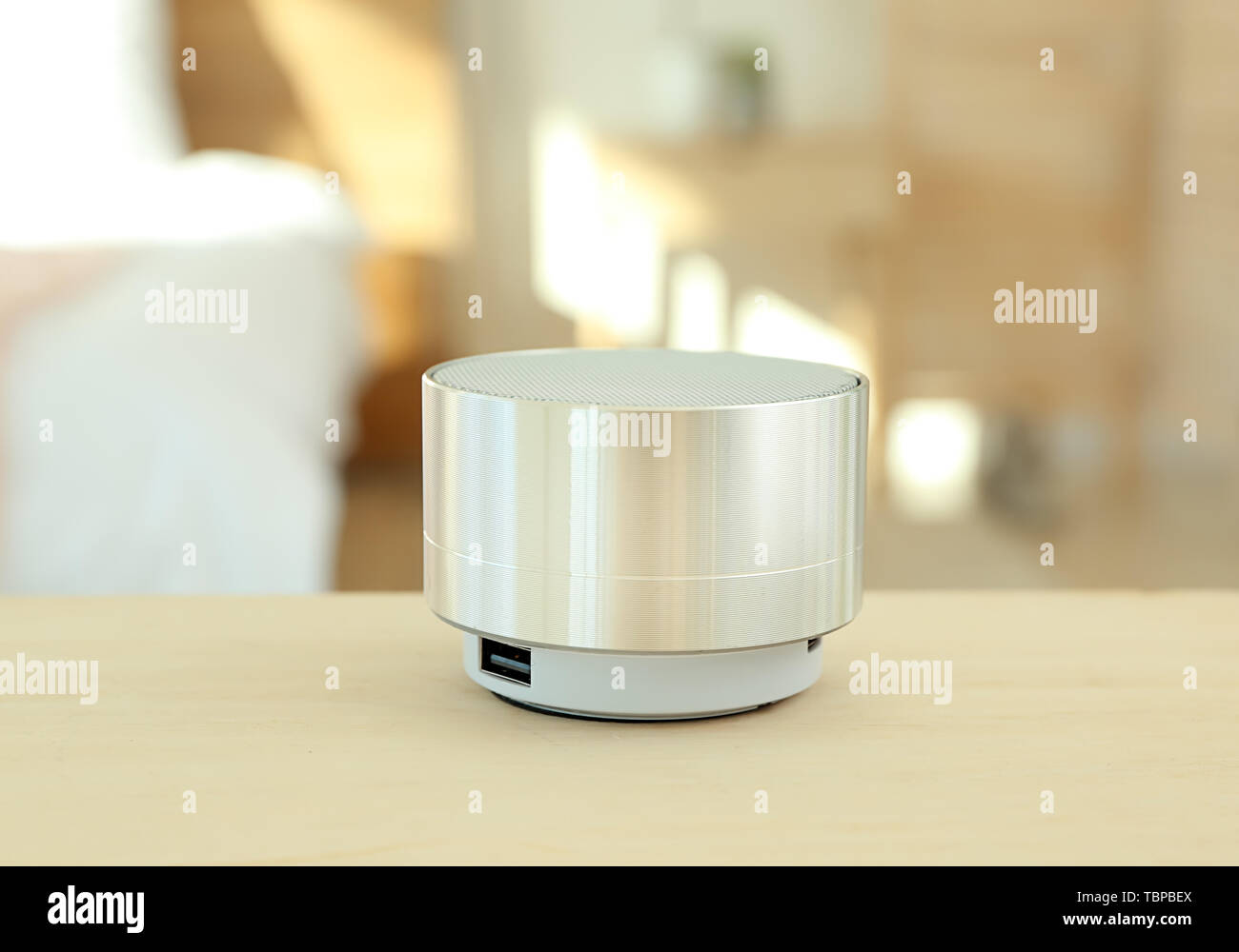Smart home assistant device on table in room Stock Photo - Alamy