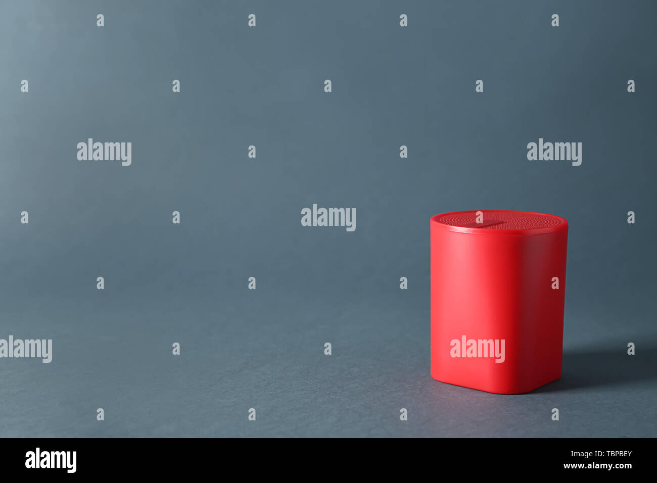 Smart home assistant device on grey background Stock Photo - Alamy