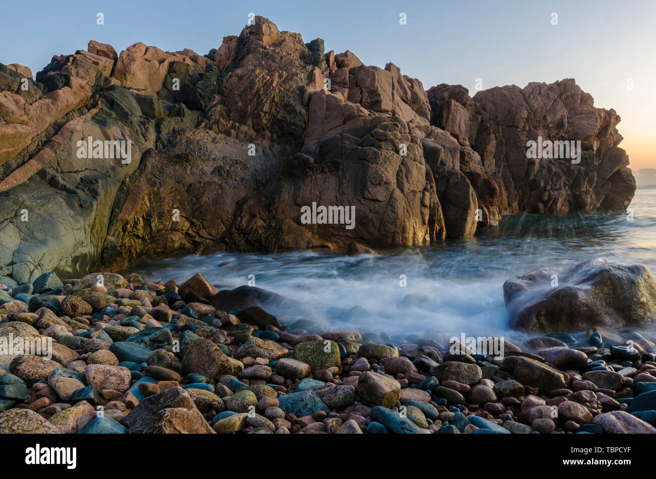 The rocks by the sea Stock Photo - Alamy