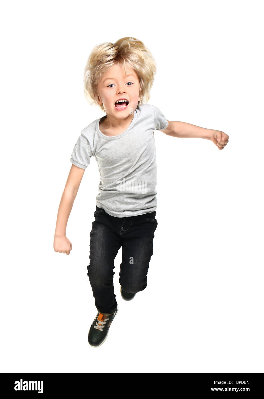 Jumping little boy on white background Stock Photo - Alamy