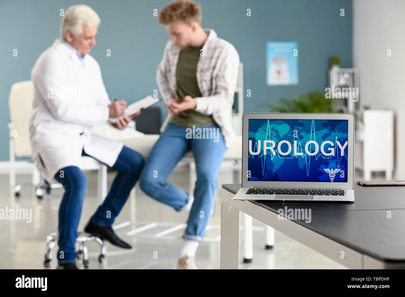 Laptop with word UROLOGY on screen in doctor's office Stock Photo - Alamy