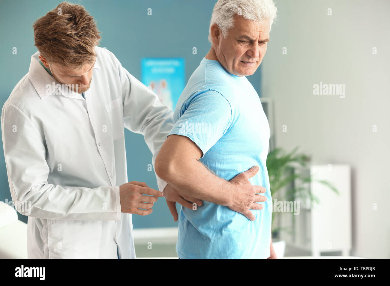 Urologist examining male patient in clinic Stock Photo - Alamy