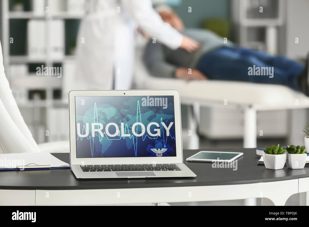 Laptop with word UROLOGY on screen in doctor's office Stock Photo - Alamy