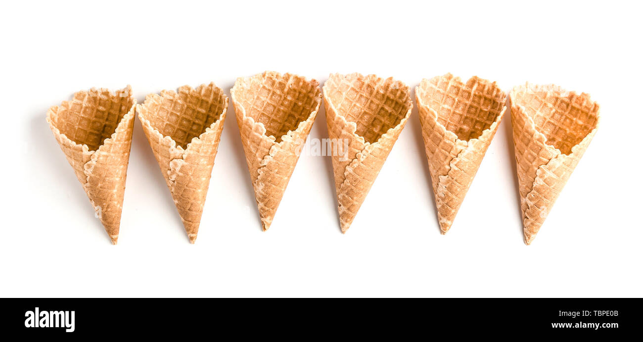 Crunchy wafer cones on white background Stock Photo - Alamy