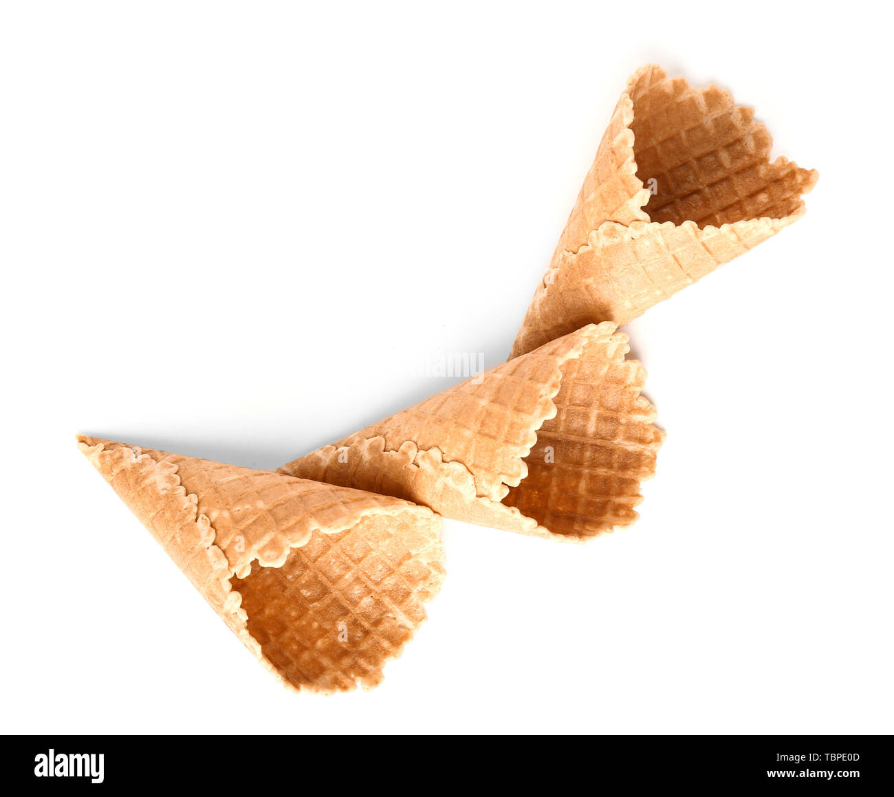 Crunchy wafer cones on white background Stock Photo - Alamy