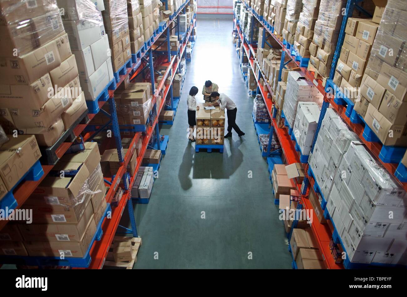 Woman stacking shelves hi-res stock photography and images - Alamy