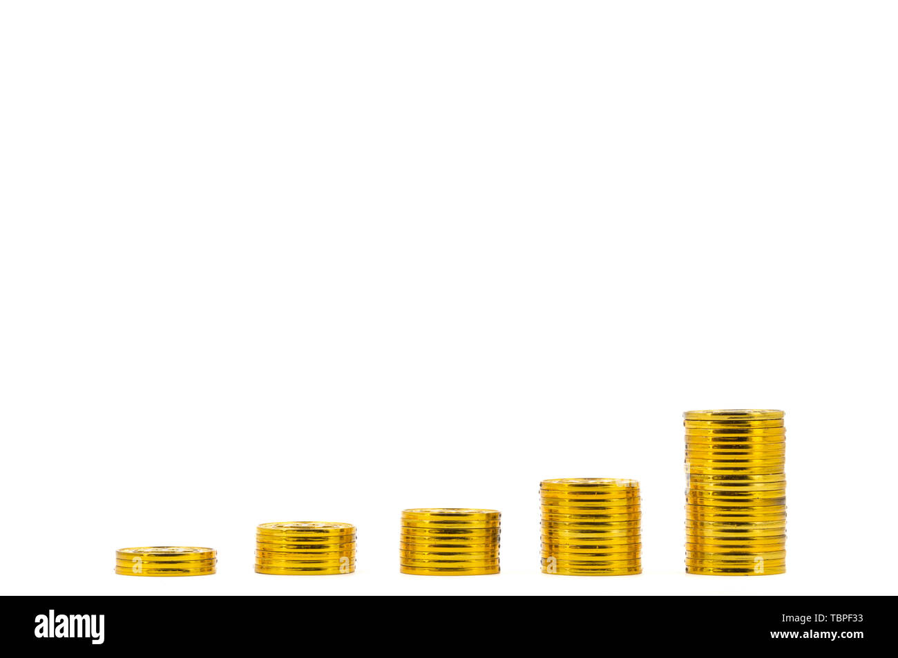 Increasing gold coins Stock Photo - Alamy