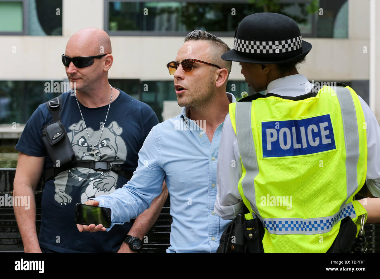 Home Office, London, UK 2 Jun 2019. - A police officer speaks with ...
