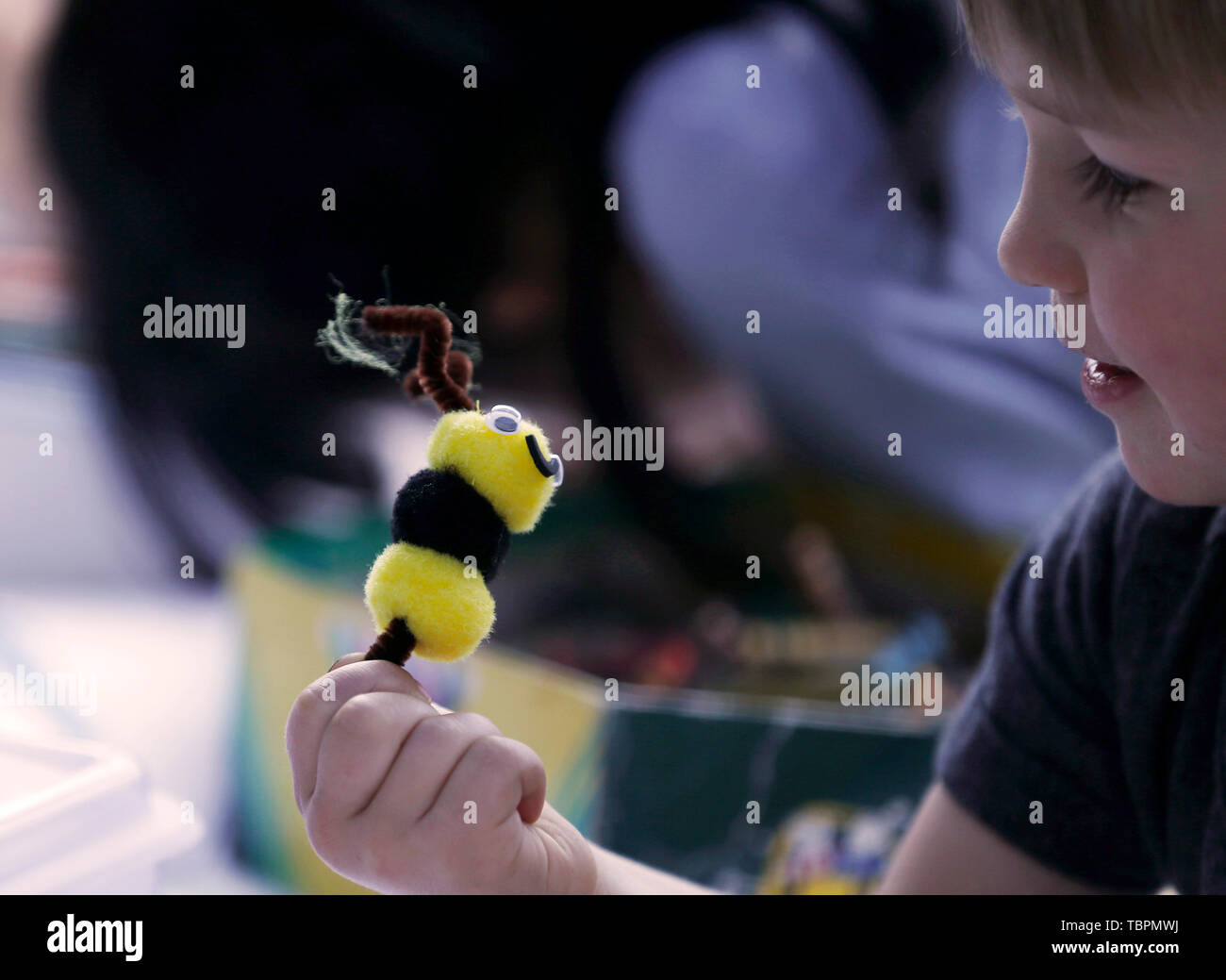 Los Angeles, USA. 2nd June, 2019. A boy watches his bee toy at "We Love ...