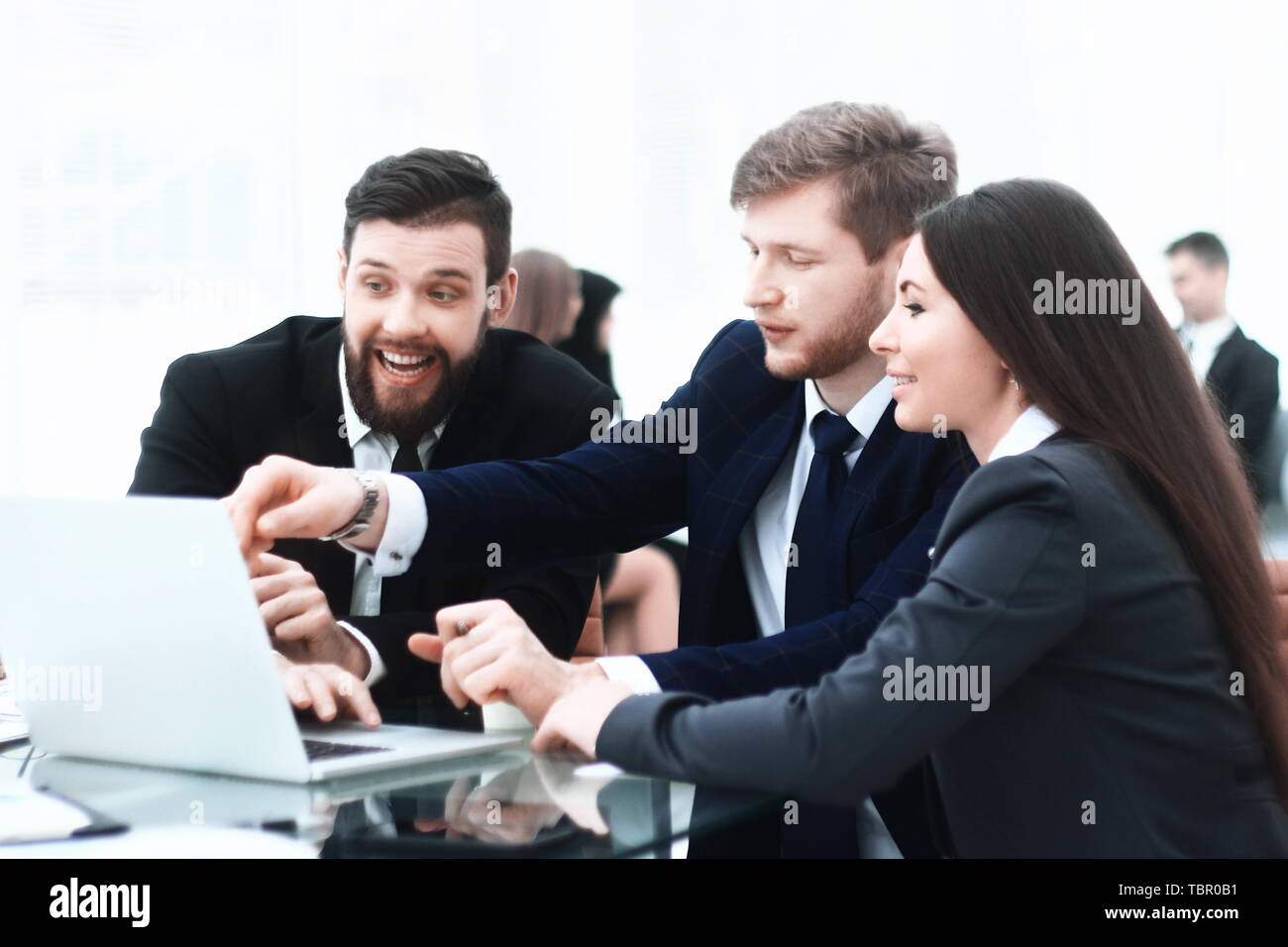 business team using laptop to work in office Stock Photo - Alamy