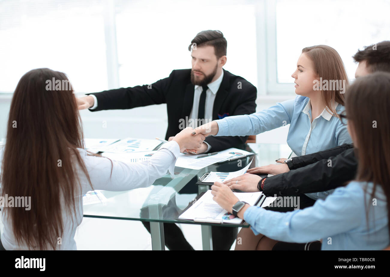 colleagues confirming the job with a handshake.teamwork Stock Photo - Alamy