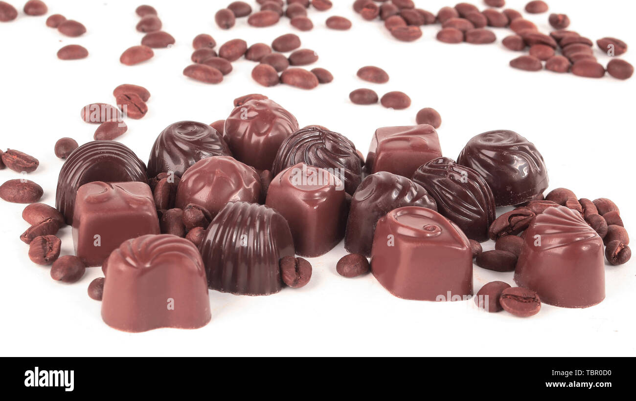 grain black coffee and chocolate candy on a white background Stock ...