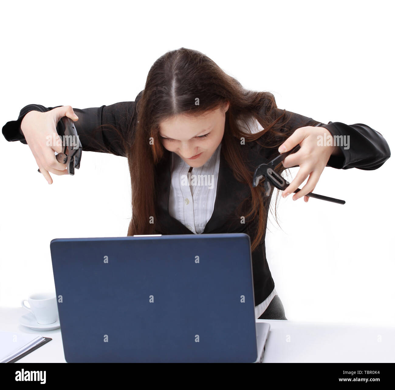 young business woman trying to break the laptop.isolated on white Stock ...