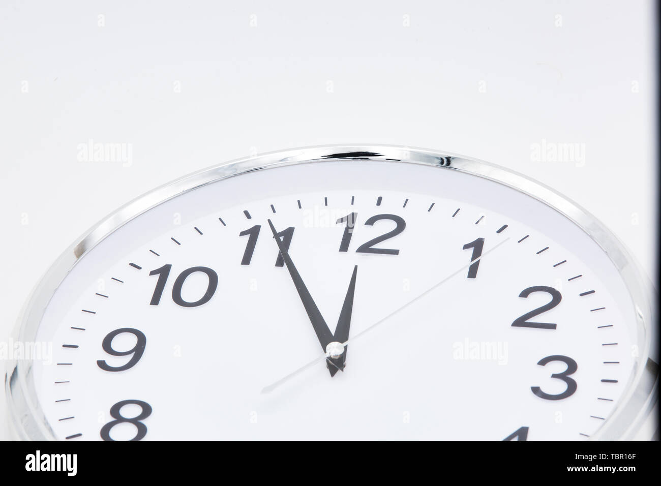 Clock on white background Stock Photo - Alamy