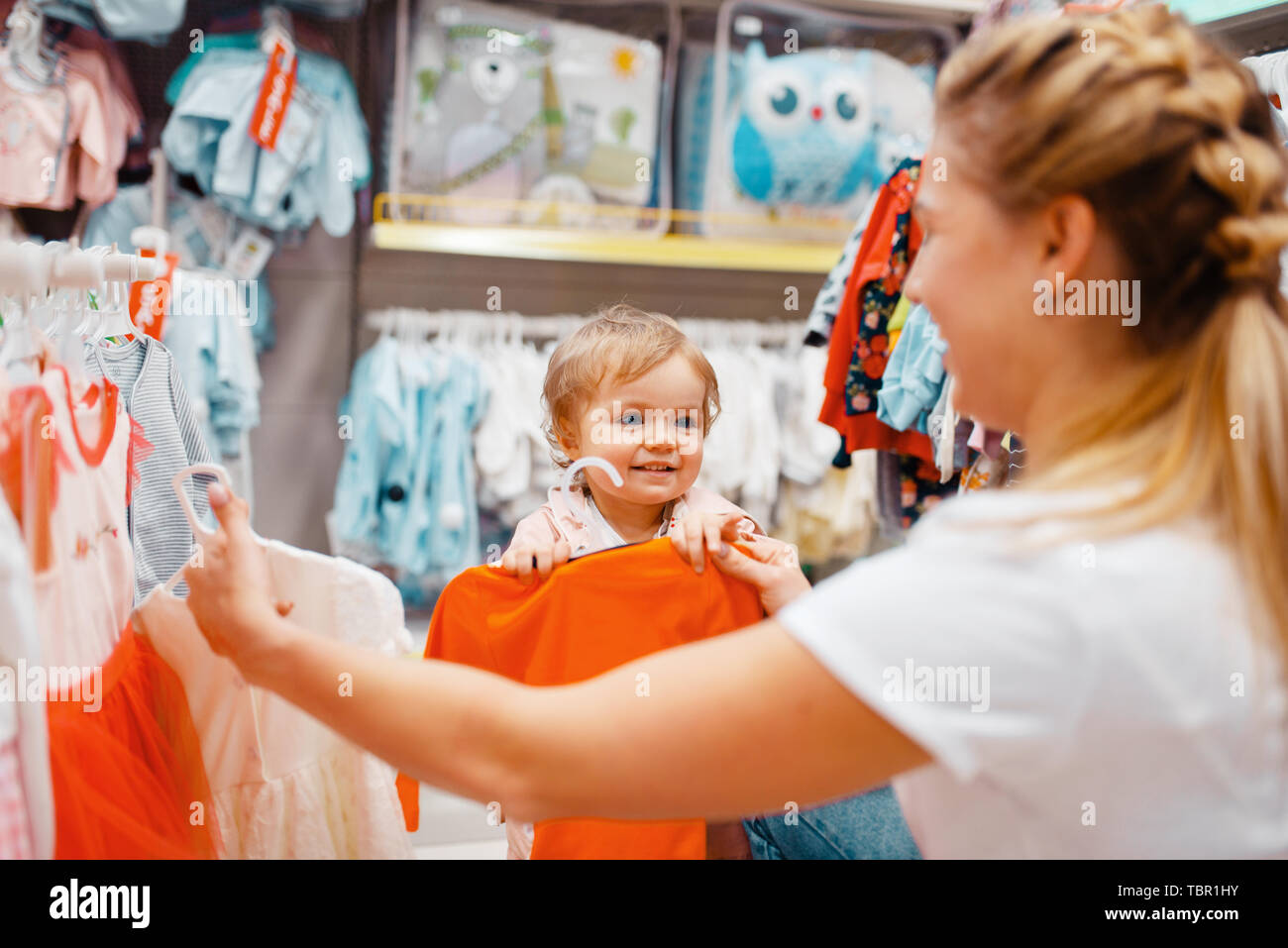 Girl choosing clothes hi-res stock photography and images - Alamy