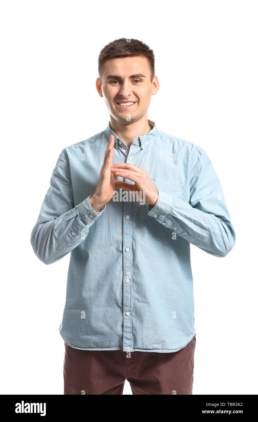 Young deaf mute man using sign language on white background Stock Photo ...