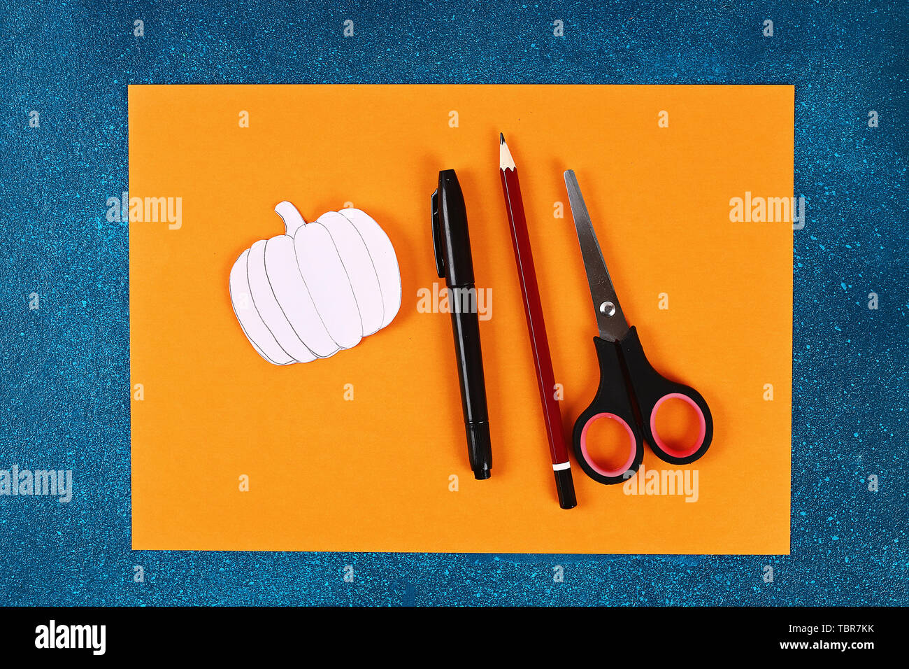 Diy Halloween paper bracelet pumpkin on black background. Gift idea ...