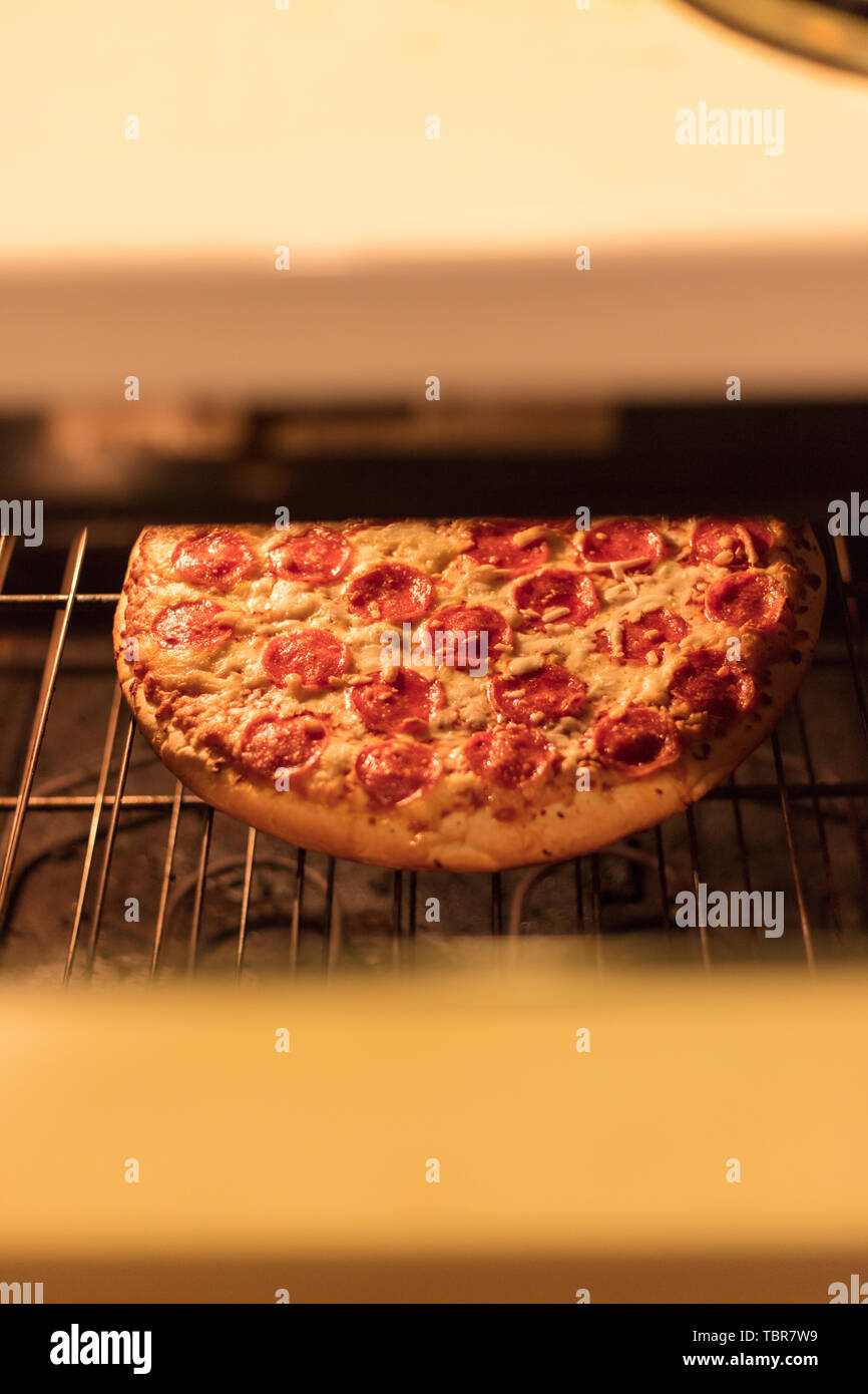 Italian red intestine pizza in the oven Stock Photo - Alamy