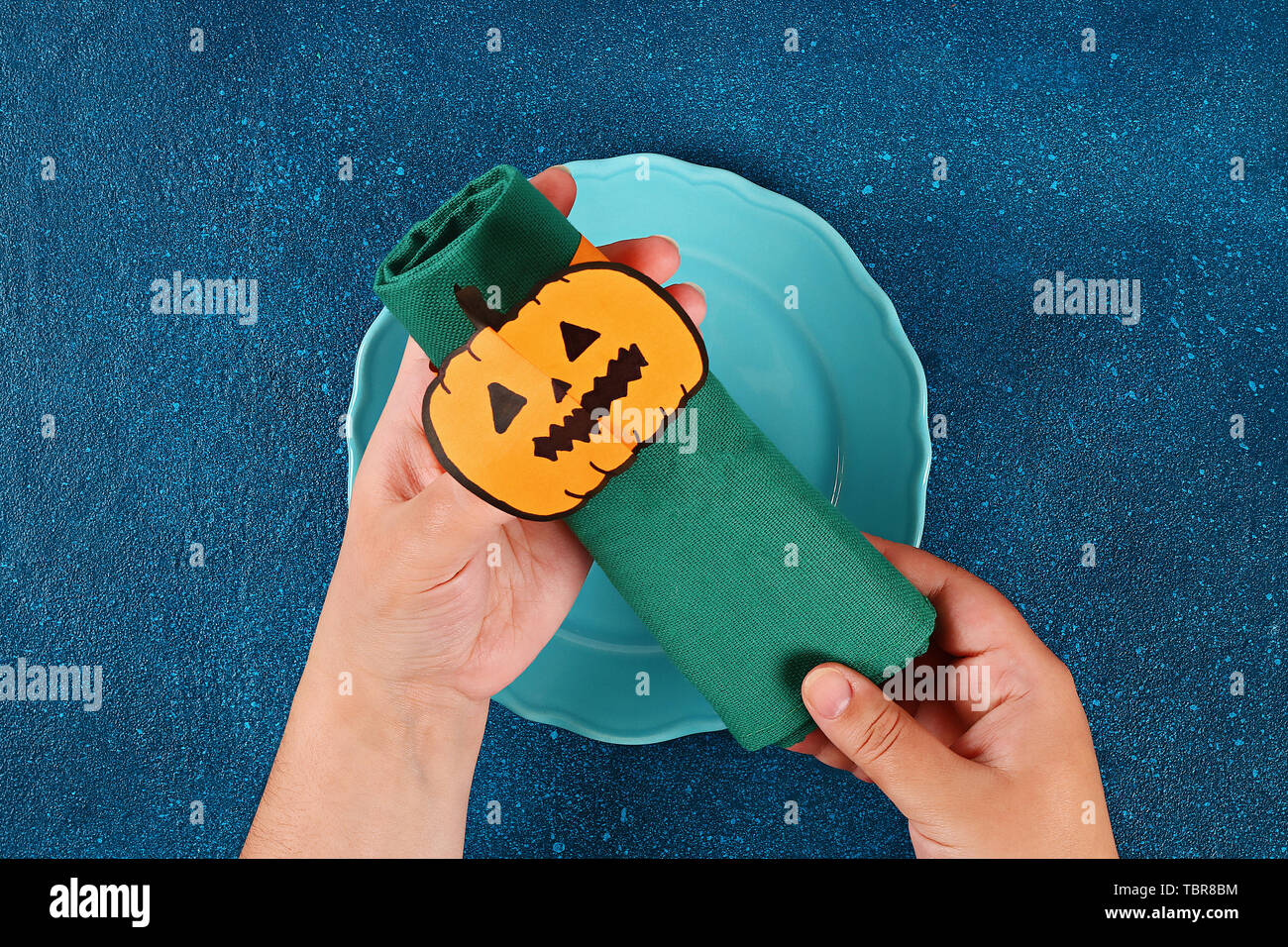 Diy Halloween paper bracelet pumpkin on black background. Gift idea ...