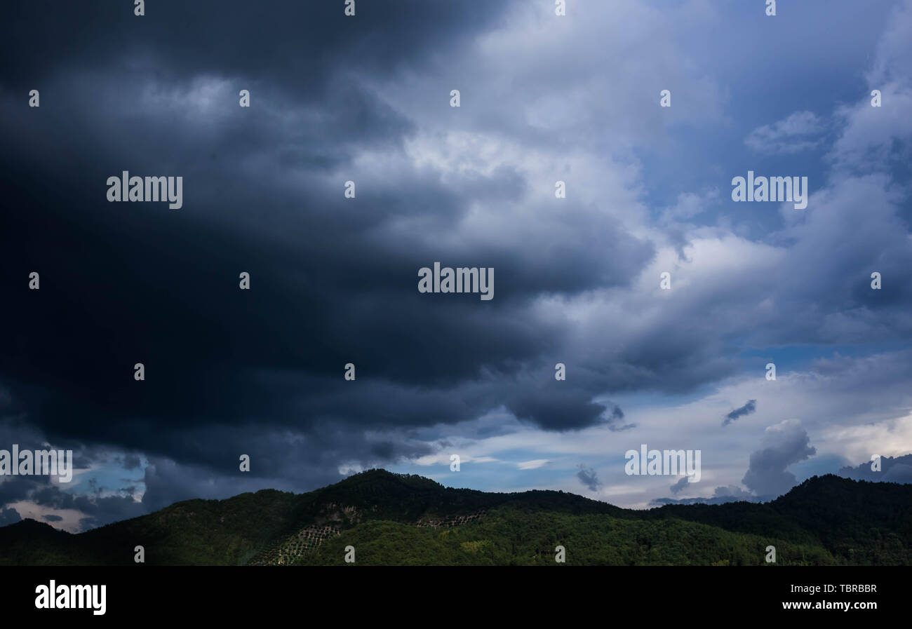 The wind rises and the clouds roll up Stock Photo - Alamy