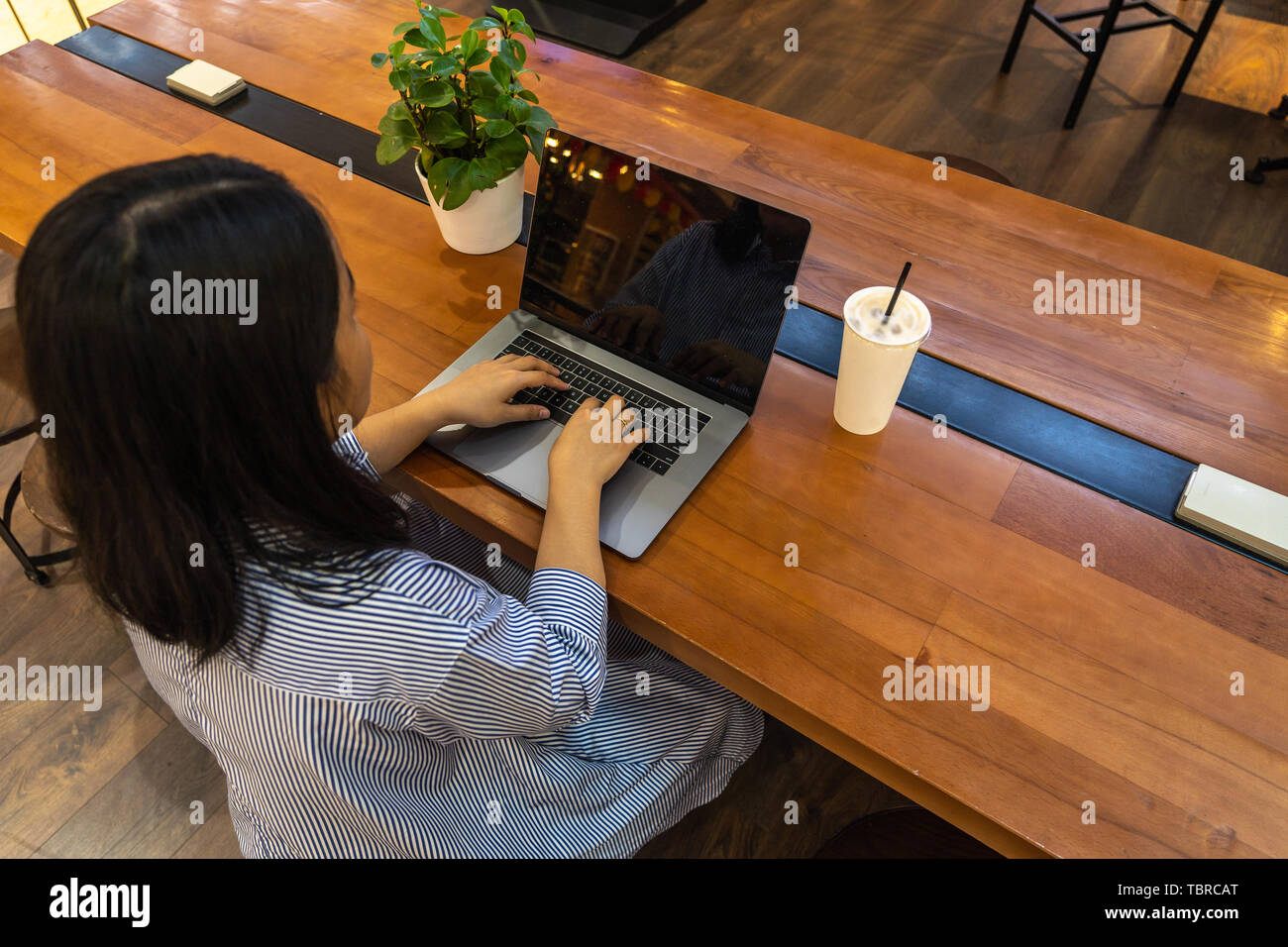 Female student typing on computer hi-res stock photography and images ...