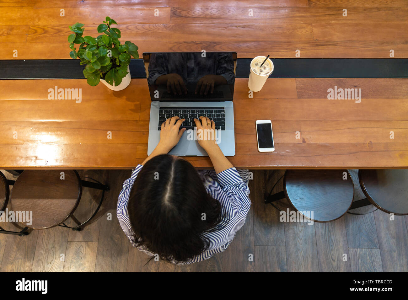Top view of Asian woman typing computer laptop Stock Photo - Alamy