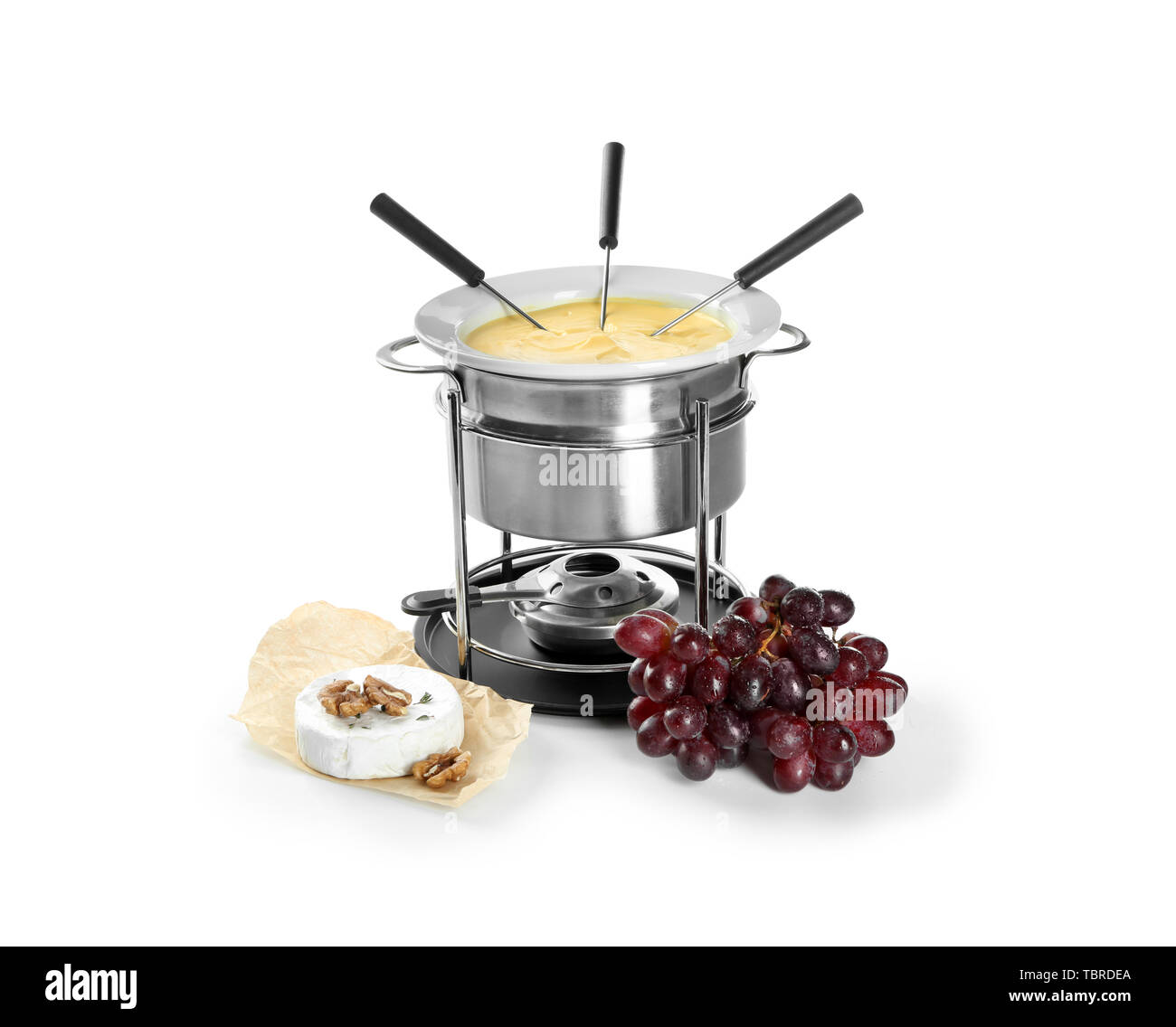 Fondue pot with melted cheese and products on white background Stock ...