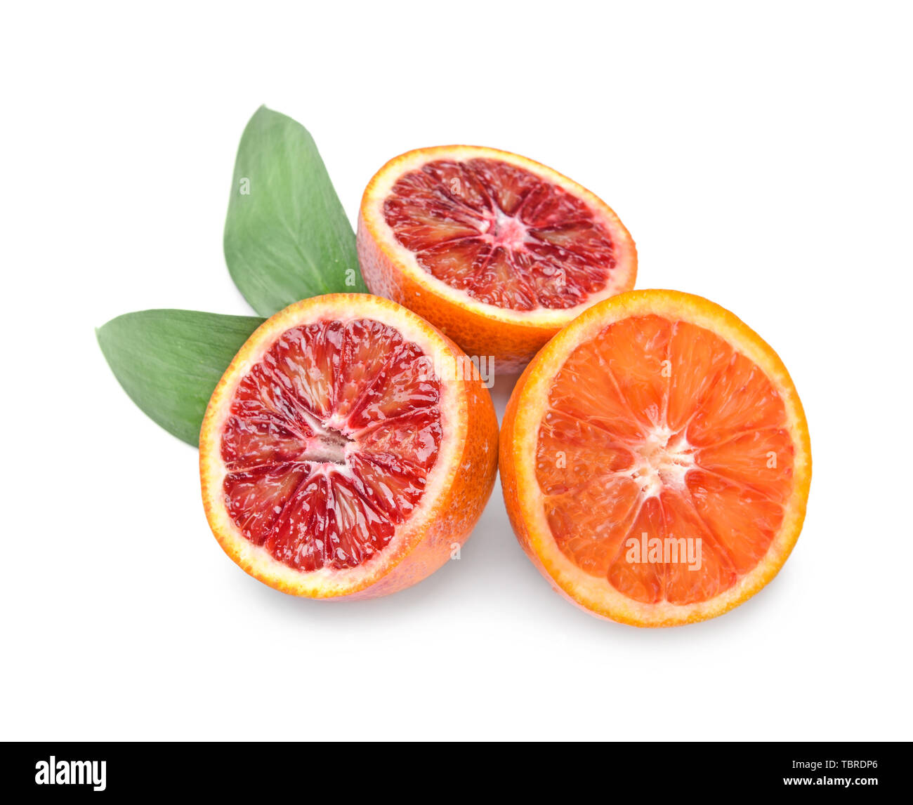 Cut blood oranges on white background Stock Photo - Alamy