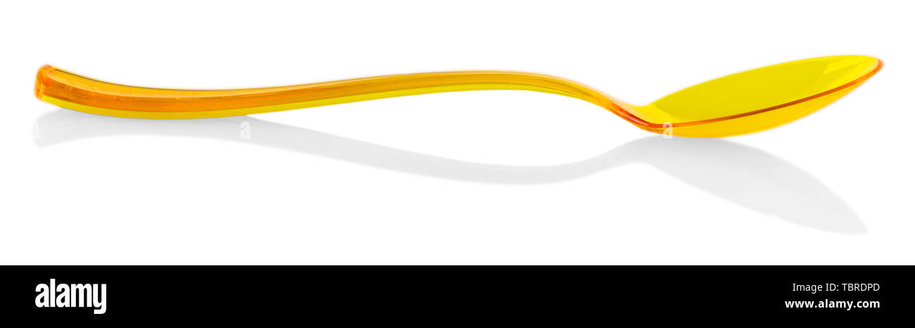 A simple bright yellow plastic spoon on white background Stock Photo ...