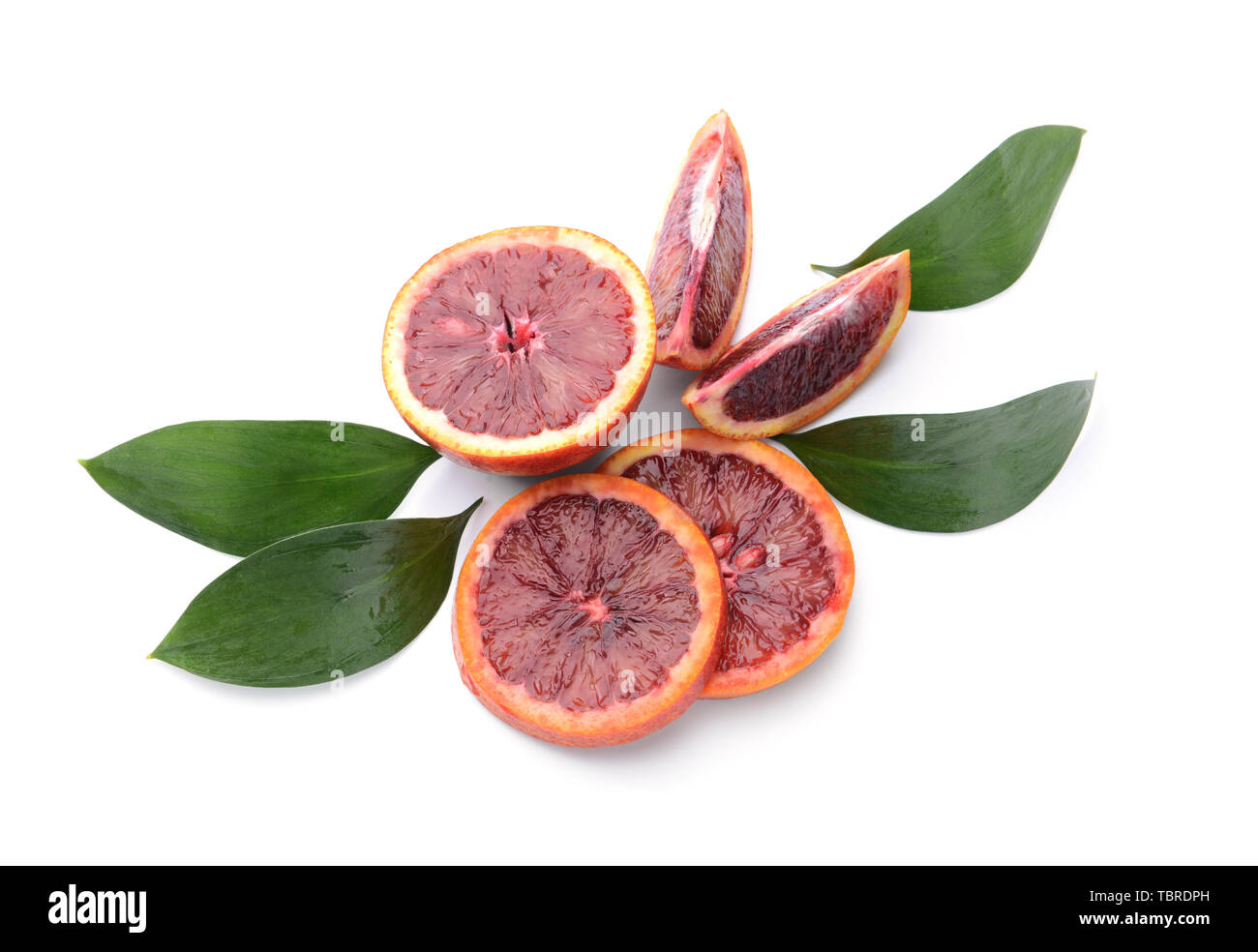 Cut blood oranges on white background Stock Photo - Alamy