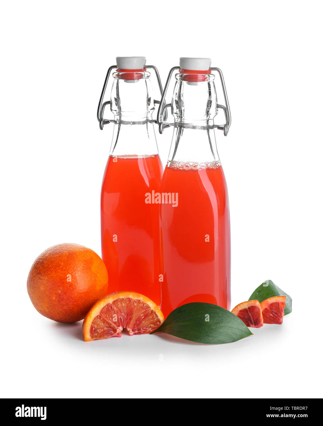 Bottles of fresh blood orange juice on white background Stock Photo - Alamy