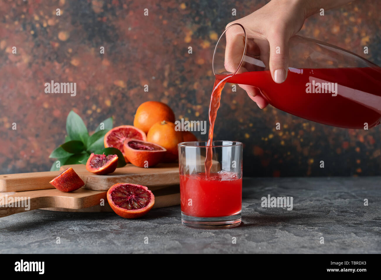 Orange juice pouring from jug hi-res stock photography and images - Alamy