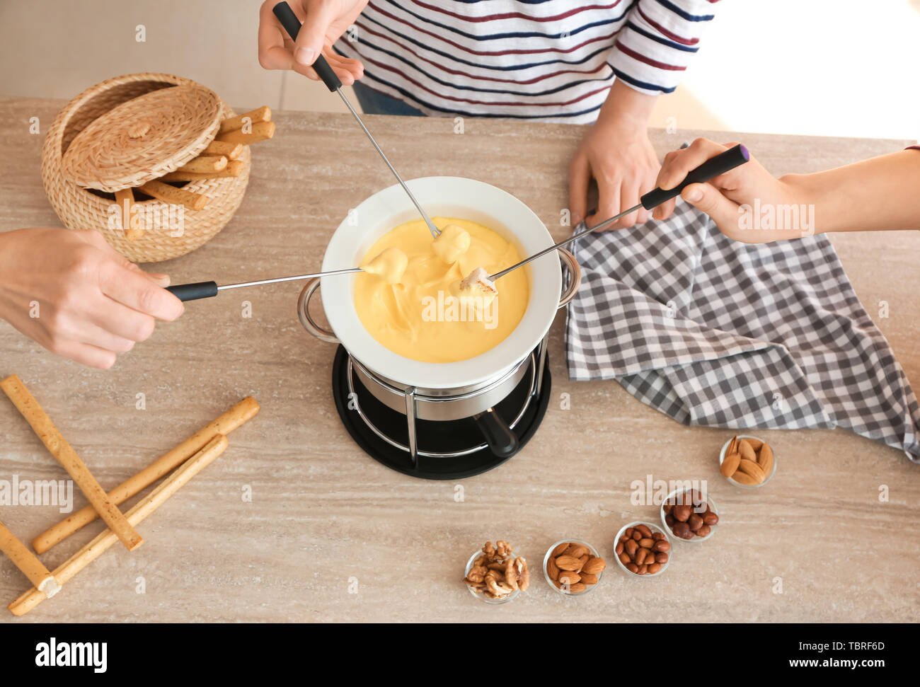 Fondue cheese friends hi-res stock photography and images - Alamy