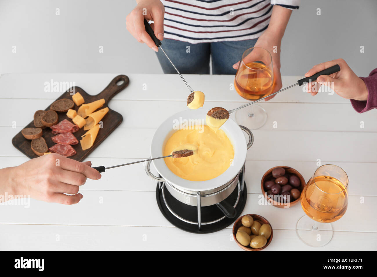 Fondue cheese friends hi-res stock photography and images - Alamy