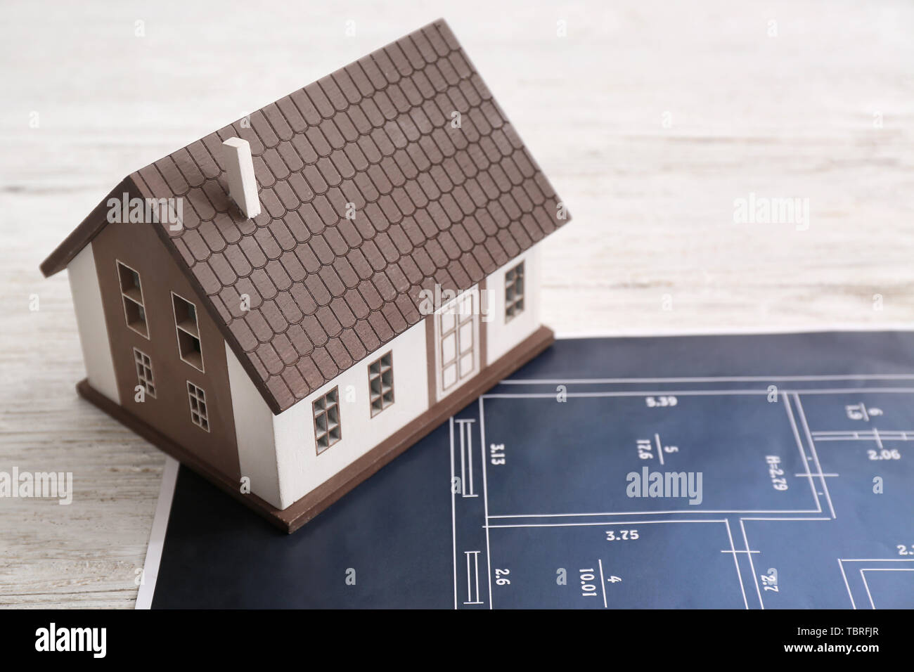 Model of house and drawing on table Stock Photo - Alamy