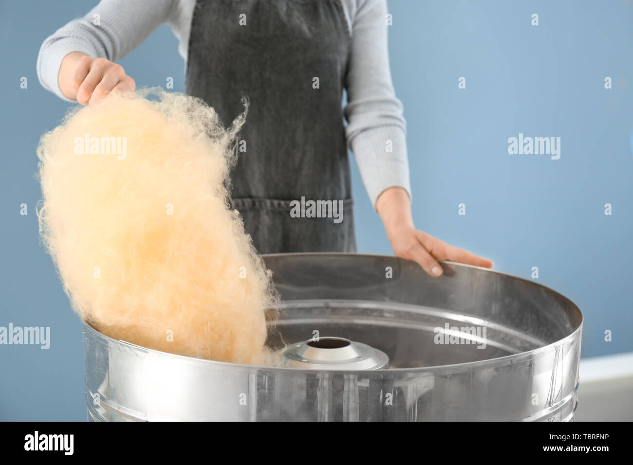 Woman making candy floss hi-res stock photography and images - Alamy
