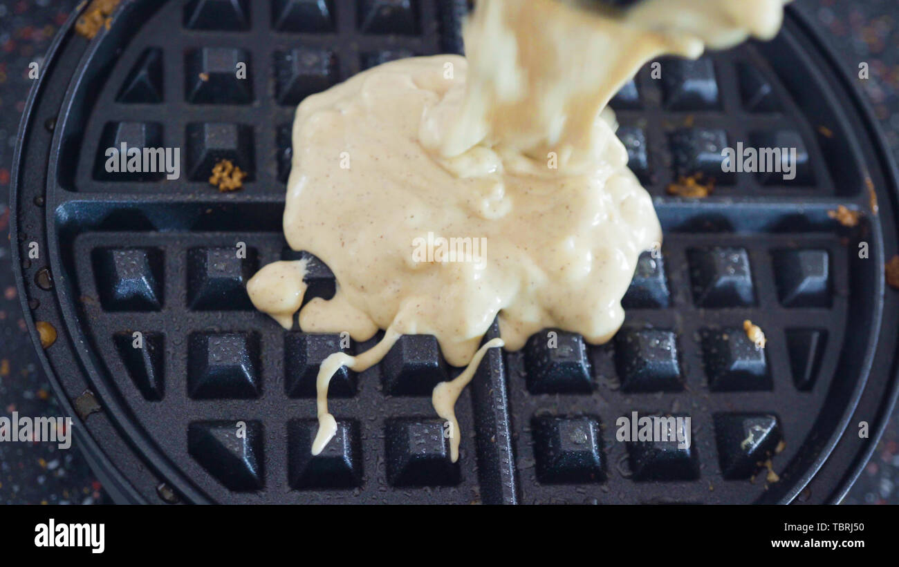 Making homemade waffles in an electric waffle maker Stock Photo - Alamy